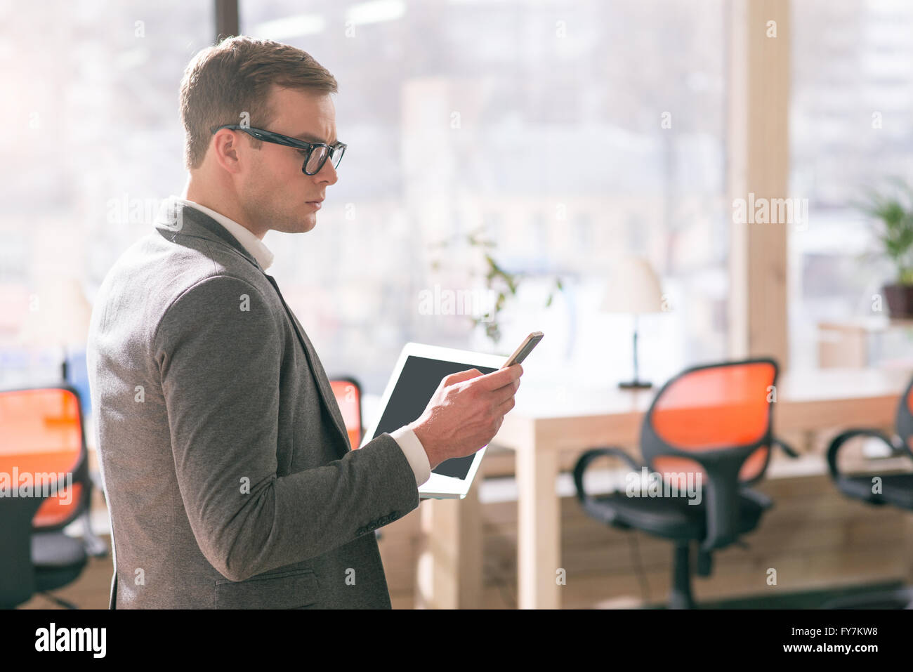 Handsome man working in the office Stock Photo - Alamy