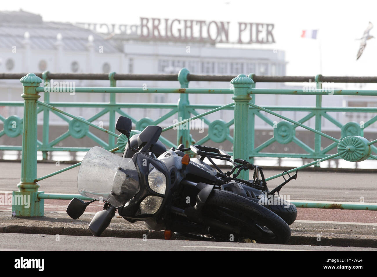 Motorcycles that fell over during a storm are pictured on their sides ...