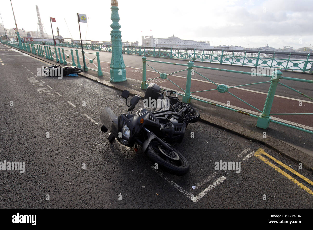Motorcycles that fell over during a storm are pictured on their sides ...