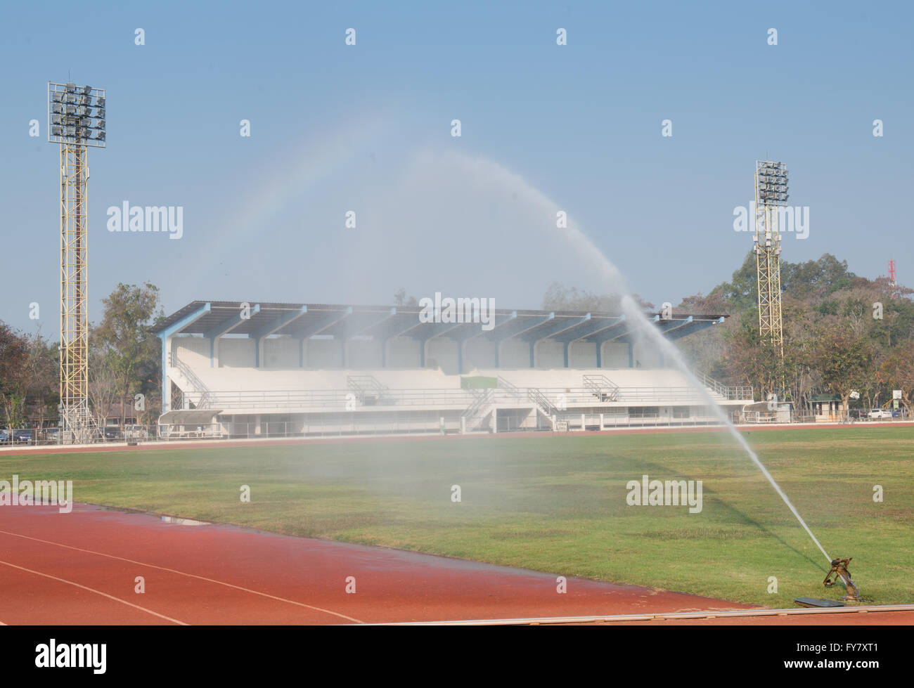 Sprinkler watering the football field Stock Photo - Alamy