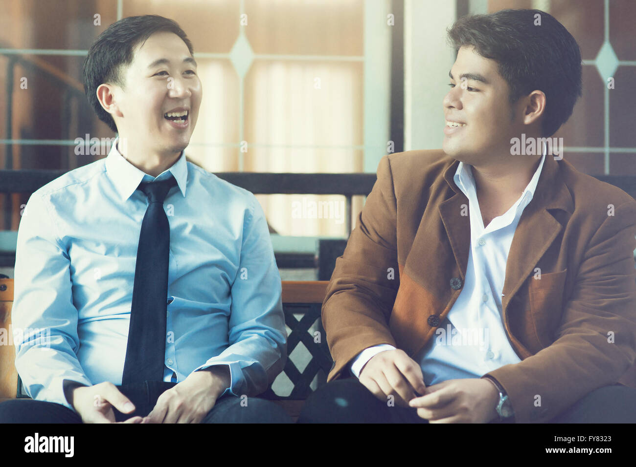Two Asian Business Men Discussing while Sitting (Vintage Tone Stock ...