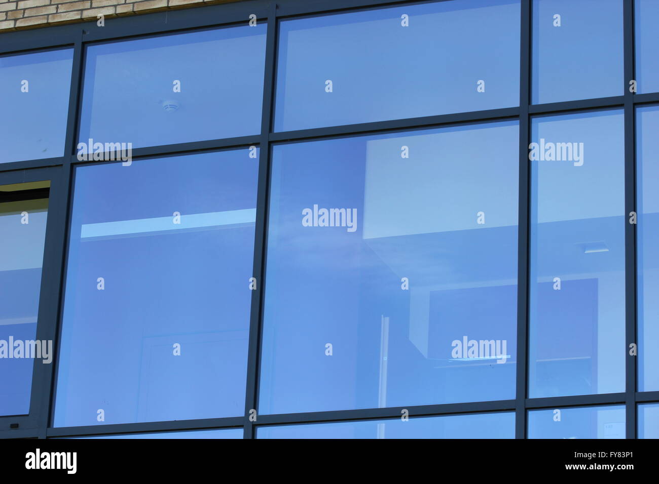Modern window reflecting blue sky Stock Photo - Alamy