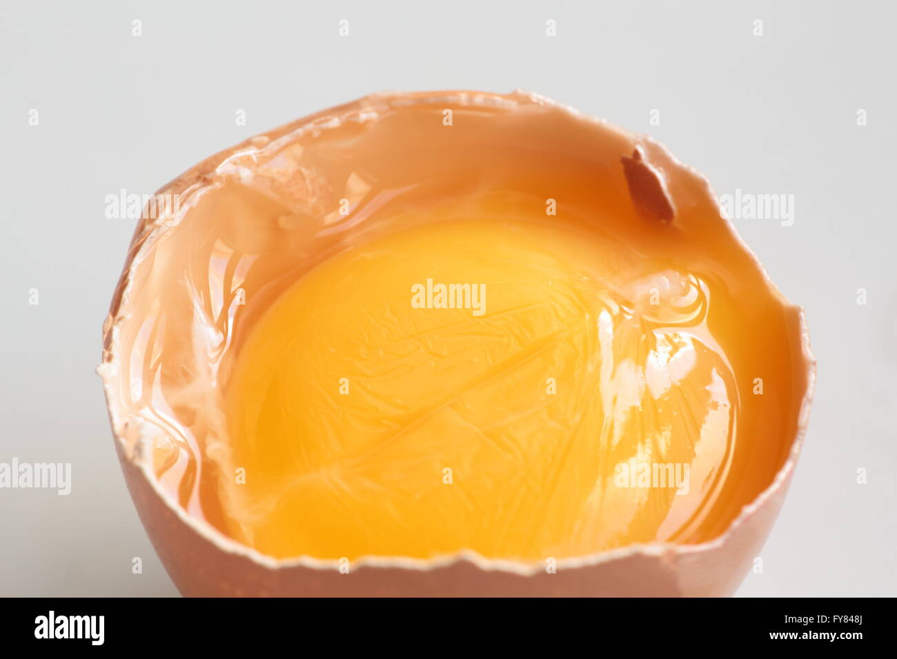 Cracking raw chicken egg hi-res stock photography and images - Alamy