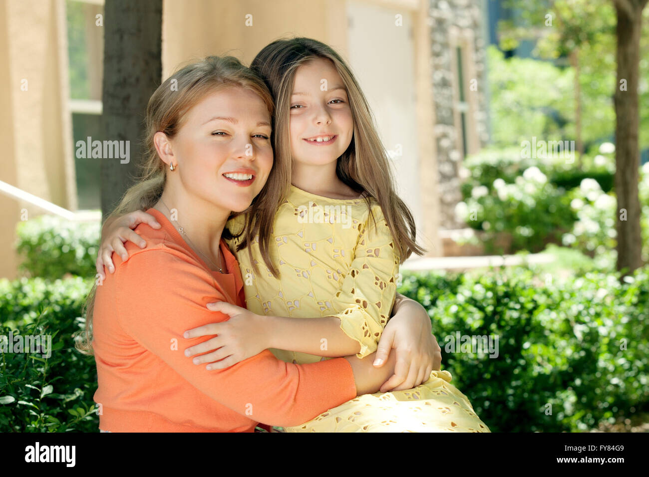 portrait of happy mother with daughter having good time in summer ...