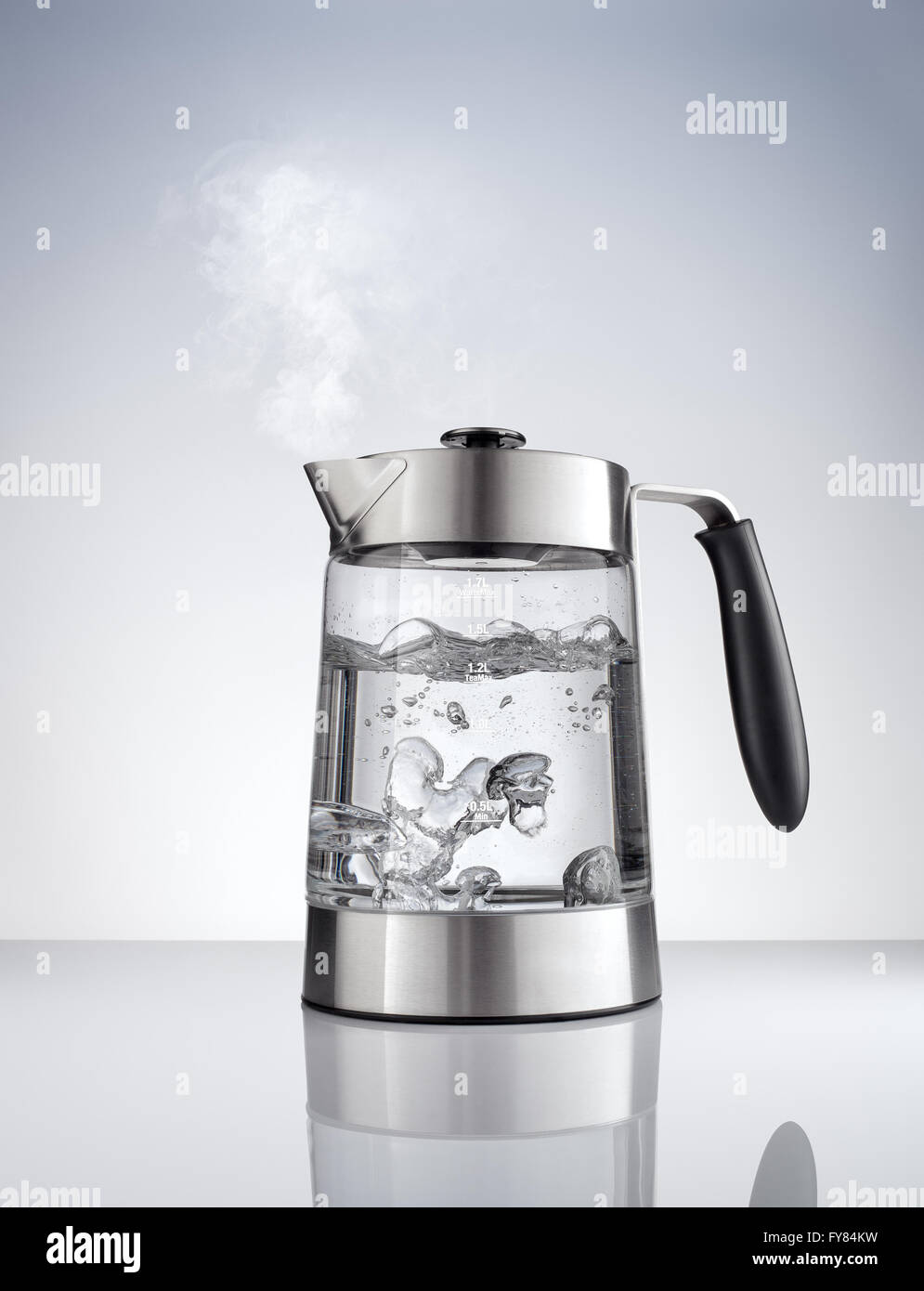 close up view of nice metal tea kettle on grey color background Stock ...