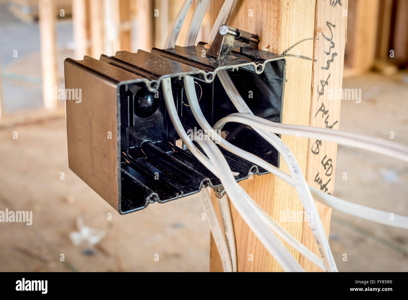 Plastic electrical box with wires coming out Stock Photo - Alamy