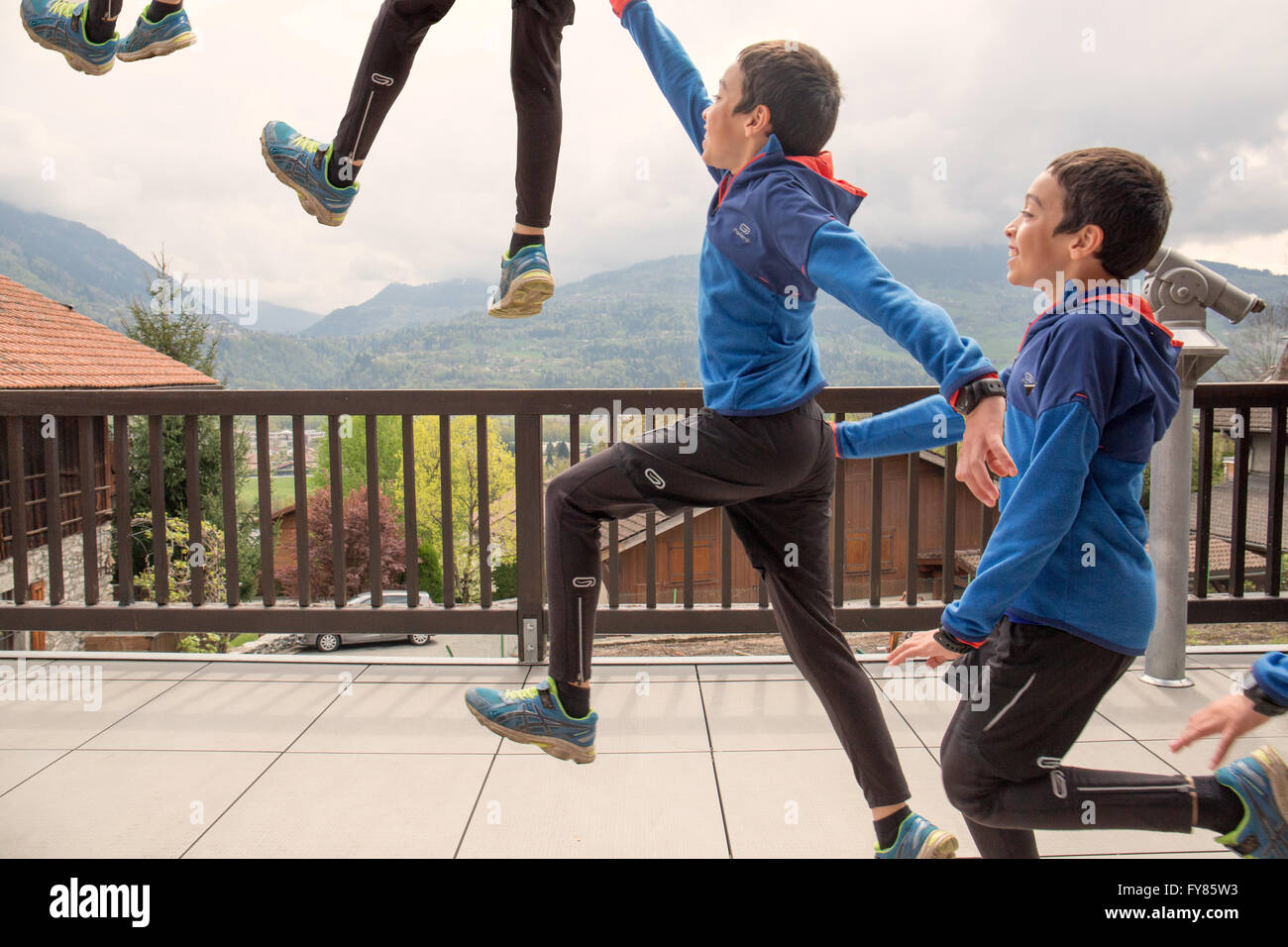 Boy taking off Stock Photo - Alamy