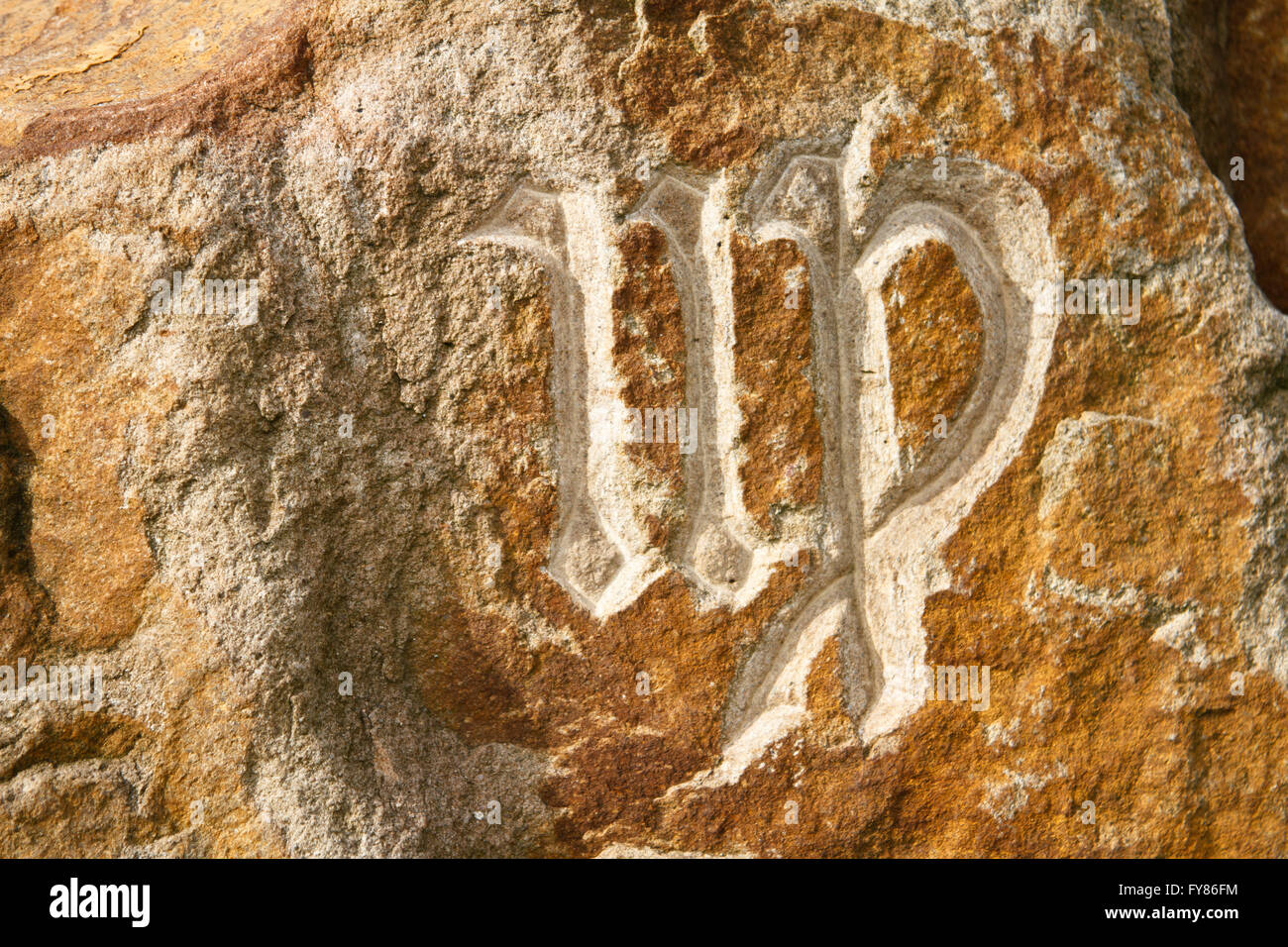 Zodiac sign of virgo engraved on sandstone rock Stock Photo - Alamy