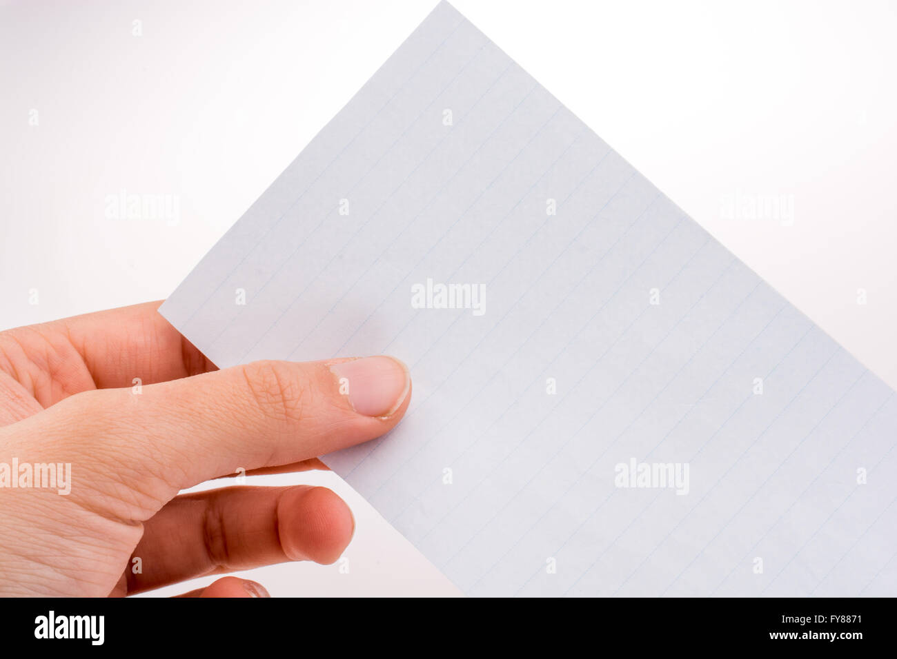 Hand holding a piece of paper on a white background Stock Photo - Alamy
