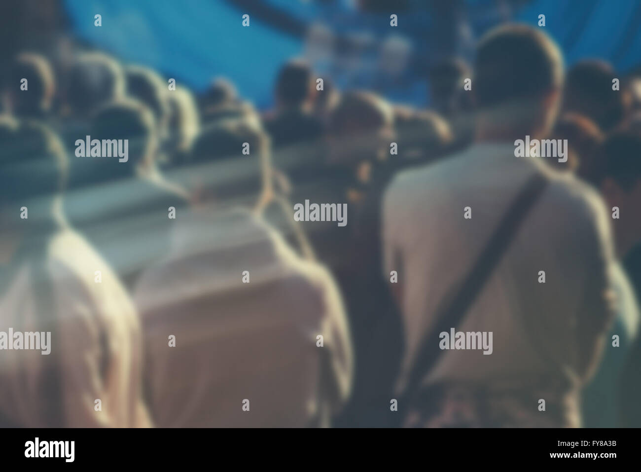 Blur unrecognizable young crowd at political meeting, cheering audience ...