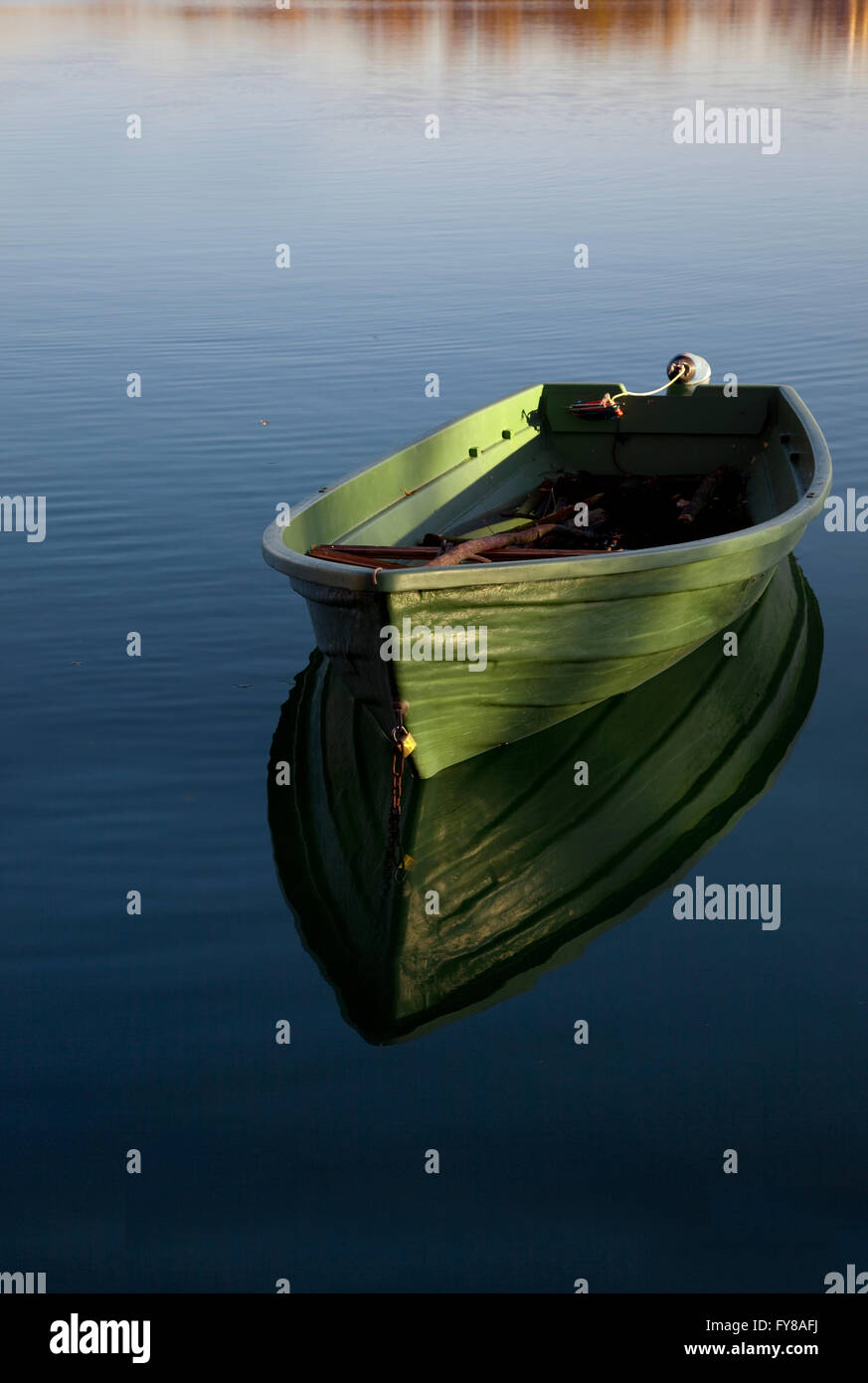 Single Row boat on Lake with Reflection in the Water Stock Photo - Alamy