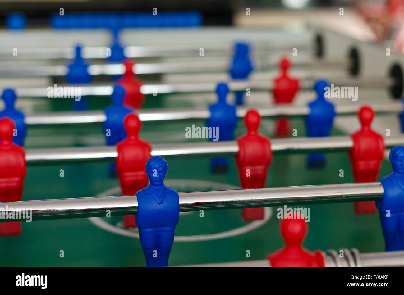 Players of the game of Foosball in red and blue color Stock Photo - Alamy