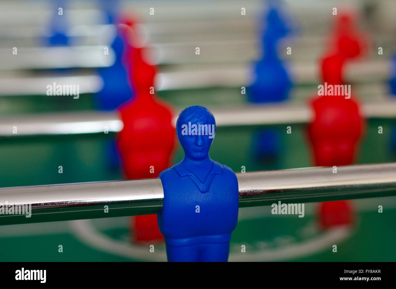 Players of the game of Foosball in red and blue color Stock Photo - Alamy