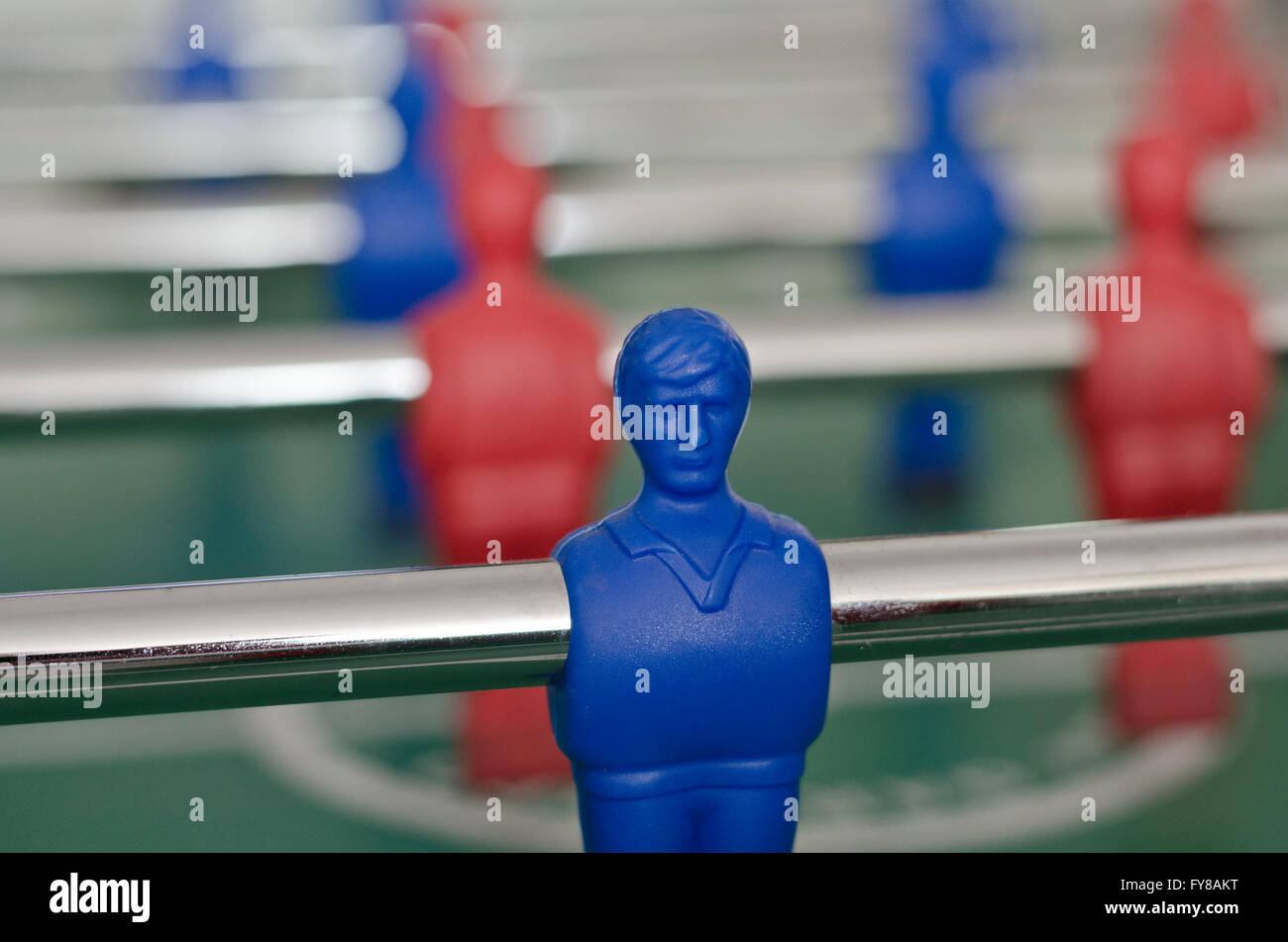 Players of the game of Foosball in red and blue color Stock Photo - Alamy