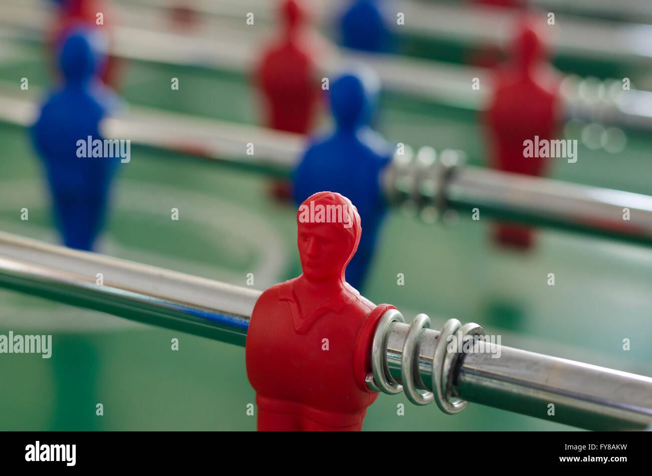 Players of the game of Foosball in red and blue color Stock Photo - Alamy
