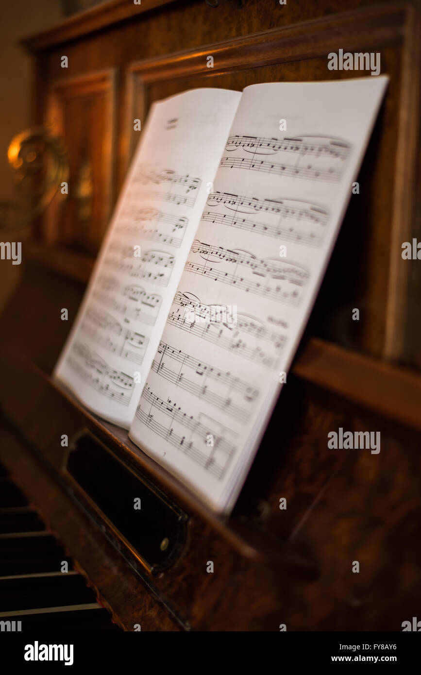 Opened Music Book on Beautiful Old Piano Stock Photo - Alamy