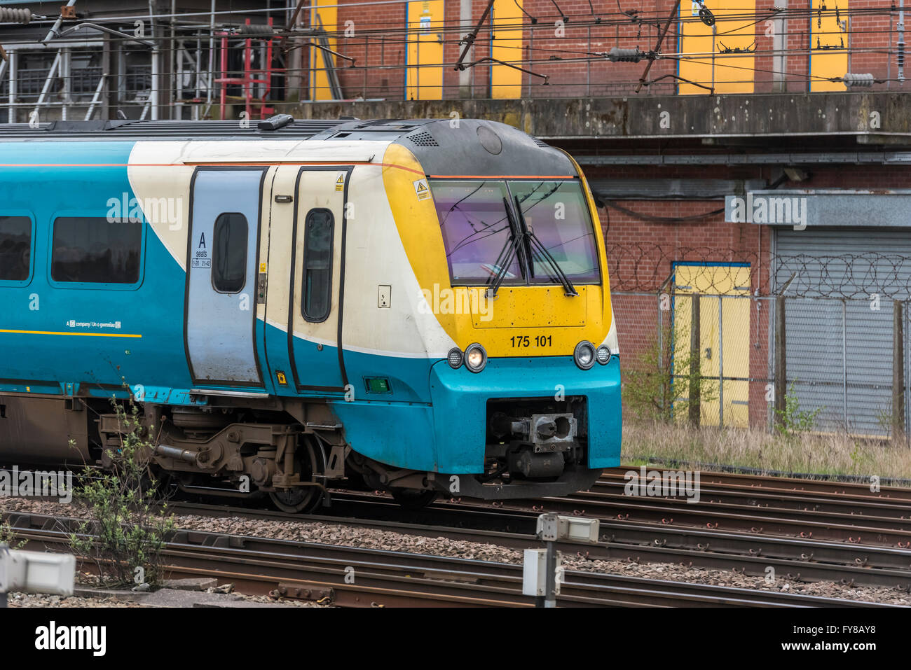 An Arriva DMU diesel train passing through Warrington Bank Quay station ...