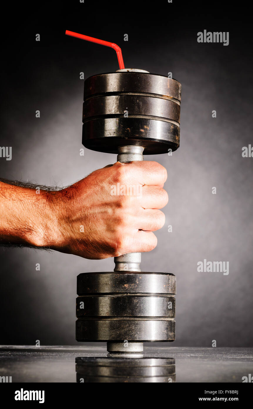 male hand is holding metal barbell Stock Photo - Alamy