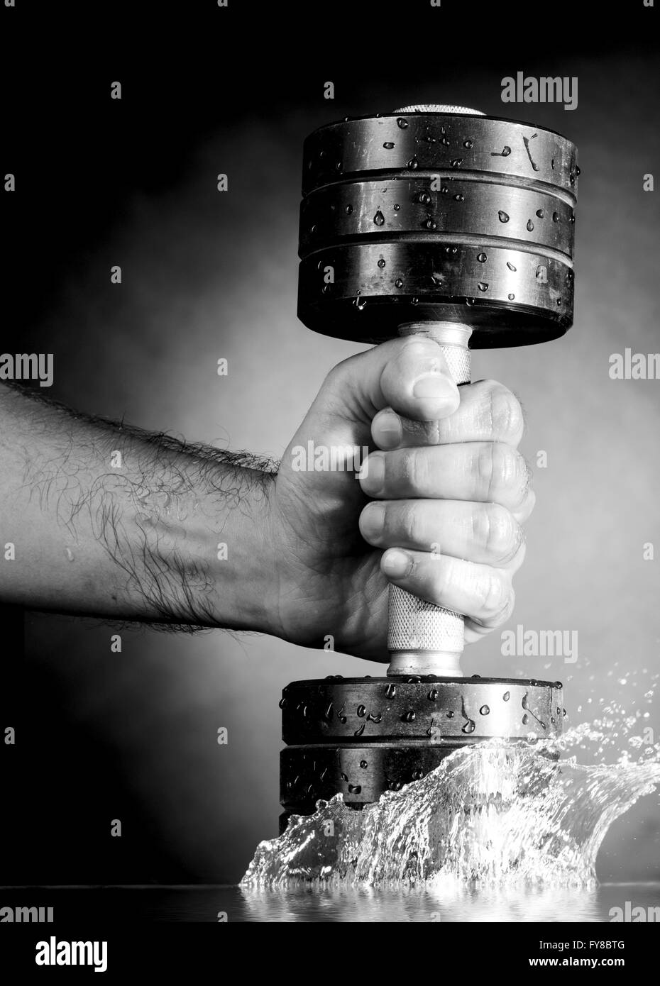 Strong man holding equipment Black and White Stock Photos & Images - Alamy