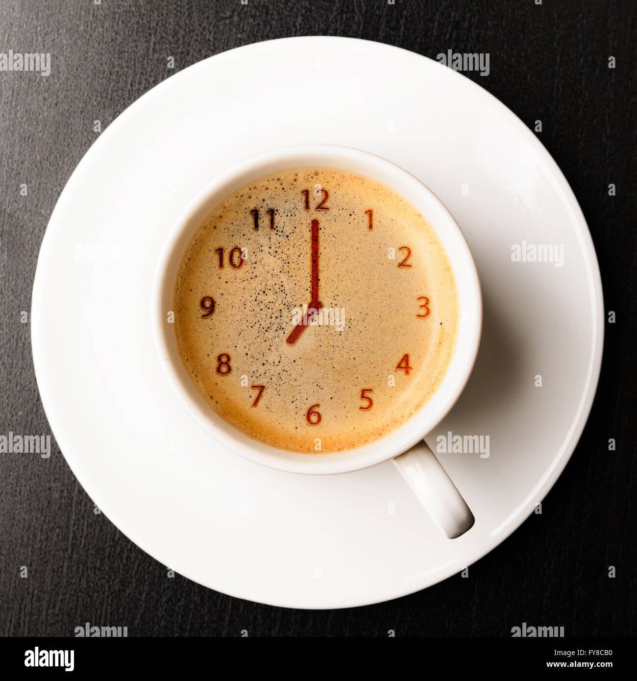 clock on cup of fresh espresso Stock Photo - Alamy
