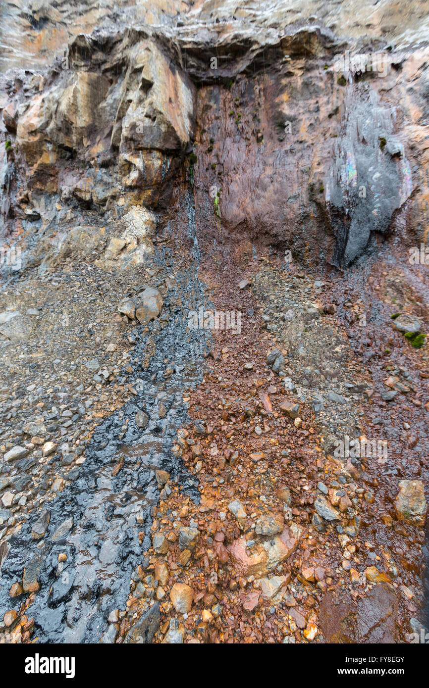 Bitumen seeping out of oil bearing rocks in an old quarry in Napo ...