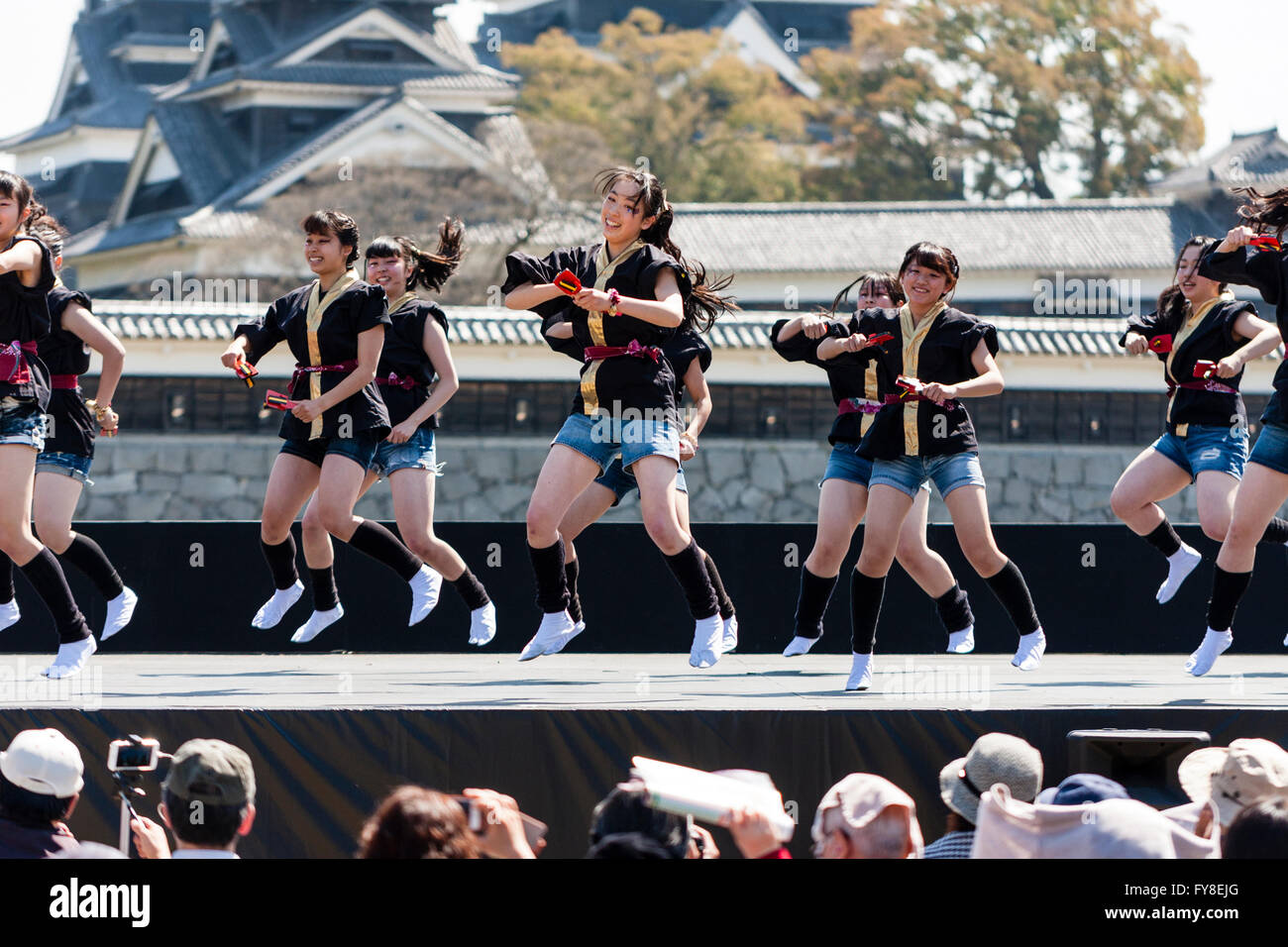 Japanese female dance troupe of teenage girls, holding naruko, dancing ...