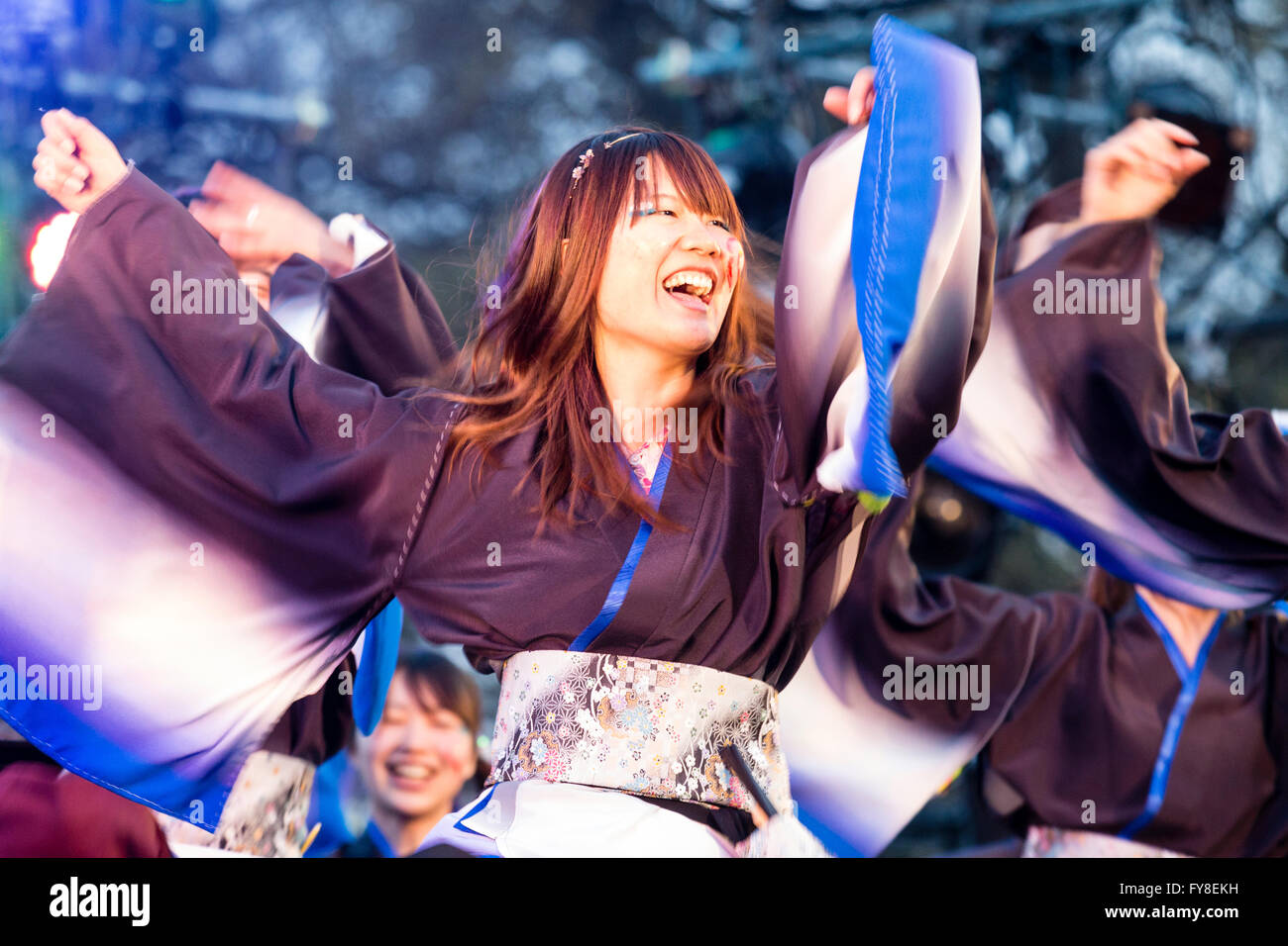 Young Japanese woman with swirling long sleeves, part of dance team ...