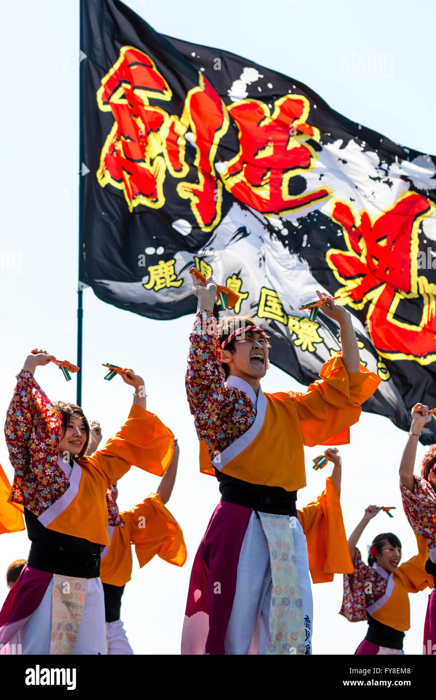 Yosakoi dance festival. Dancers with raised arms and holding naruko ...
