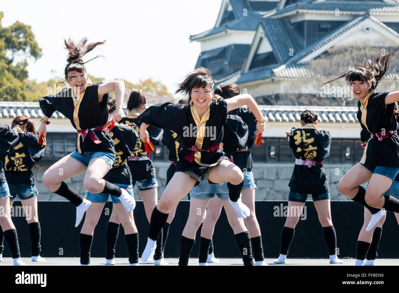 Japanese female dance troupe of teenage girls, holding naruko, dancing ...
