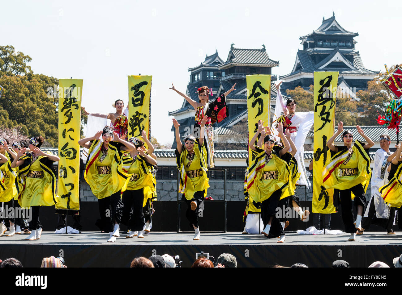 Japanese yosaki festival, female troupe dancing in black and yellow ...