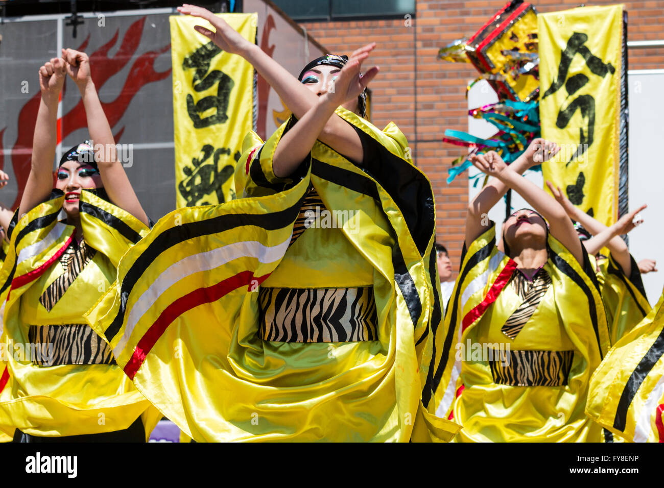 Yosakoi festival, Japan. Young female dance troupe in black and yellow ...