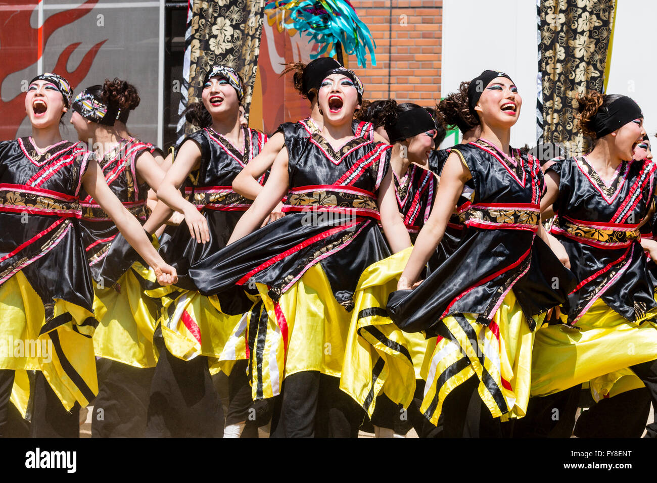 Yosakoi festival, Japan. Young female dance troupe in black and yellow ...