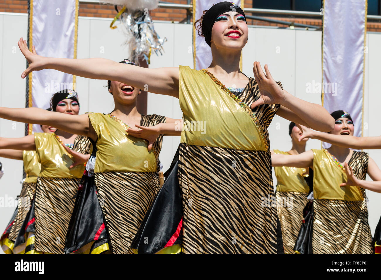 Yosakoi festival, Japan. Young female dance troupe in black and yellow ...