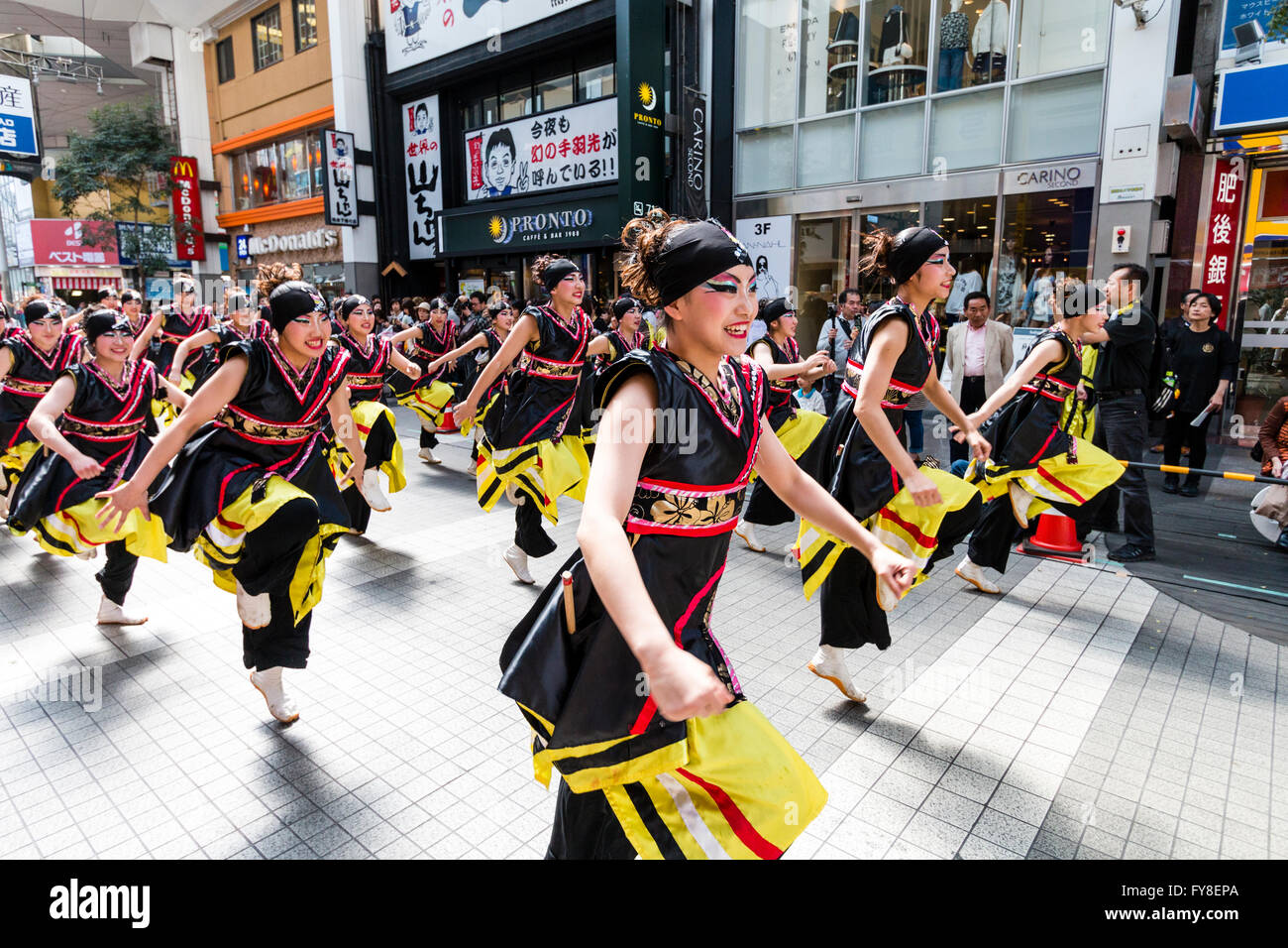 Japanese young women dance team in black and yellow outfits formation ...