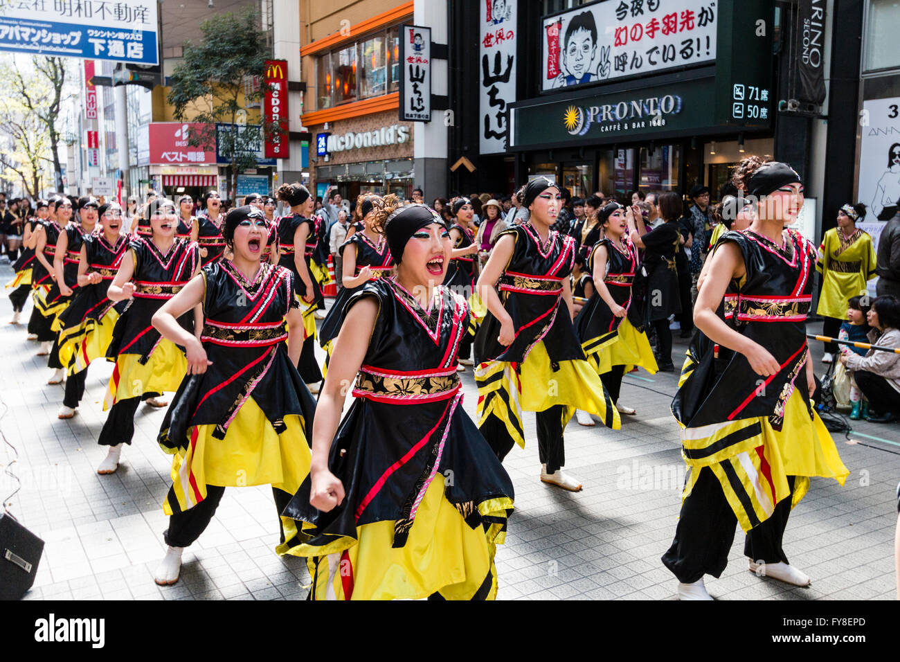 Japanese young women dance team in black and yellow outfits formation ...