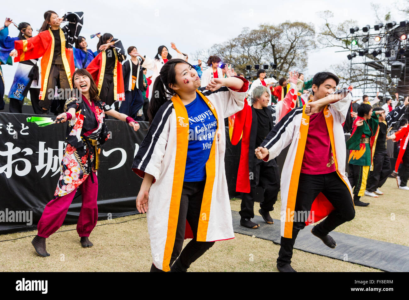 Japanese dance troupe, in traditional long yukata jackets, dancing on ...