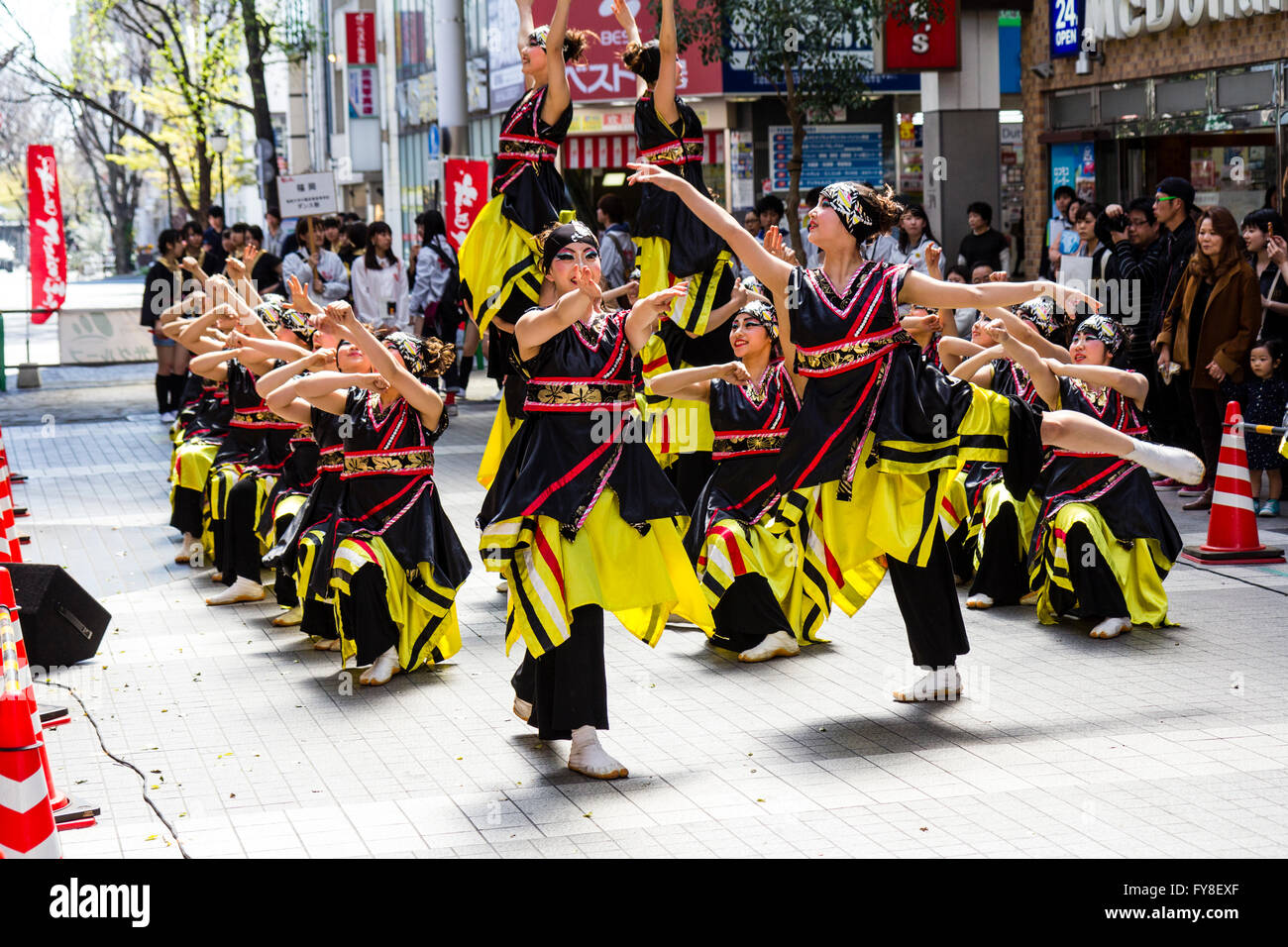 Japanese young women dance team in black and yellow outfits formation ...