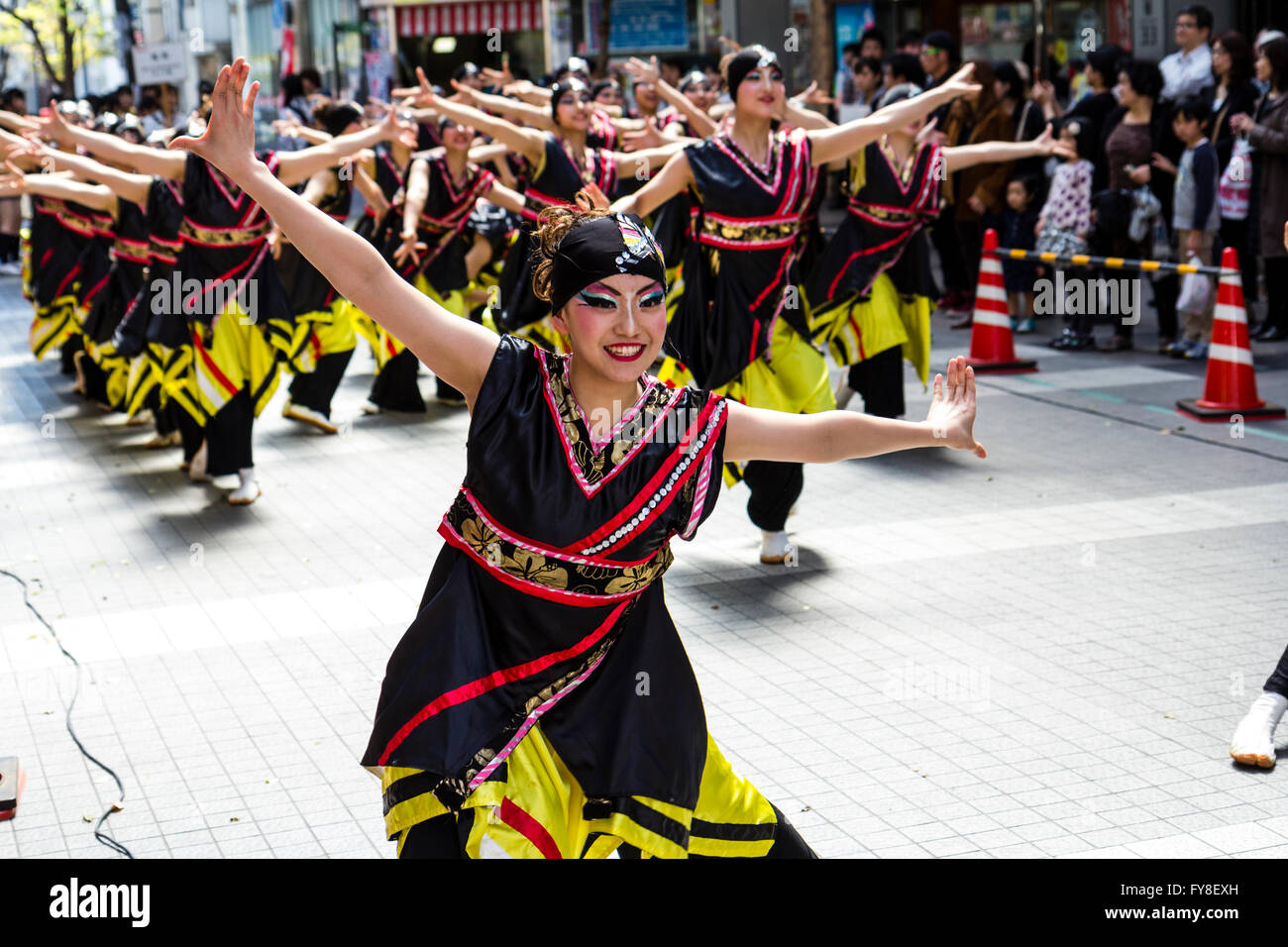 Japanese young women dance team in black and yellow outfits formation ...