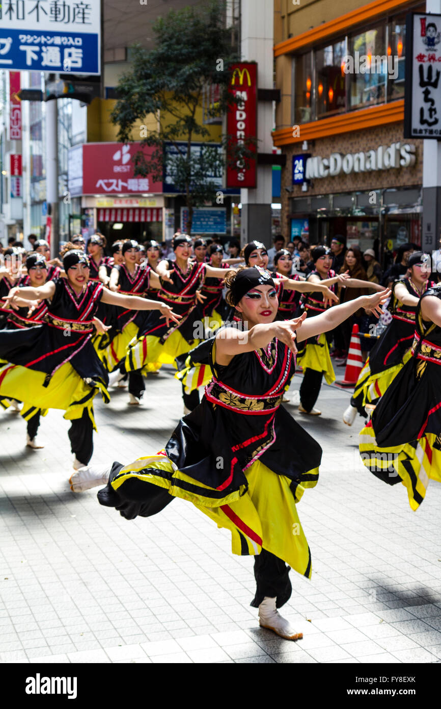 Japanese young women dance team in black and yellow outfits formation ...
