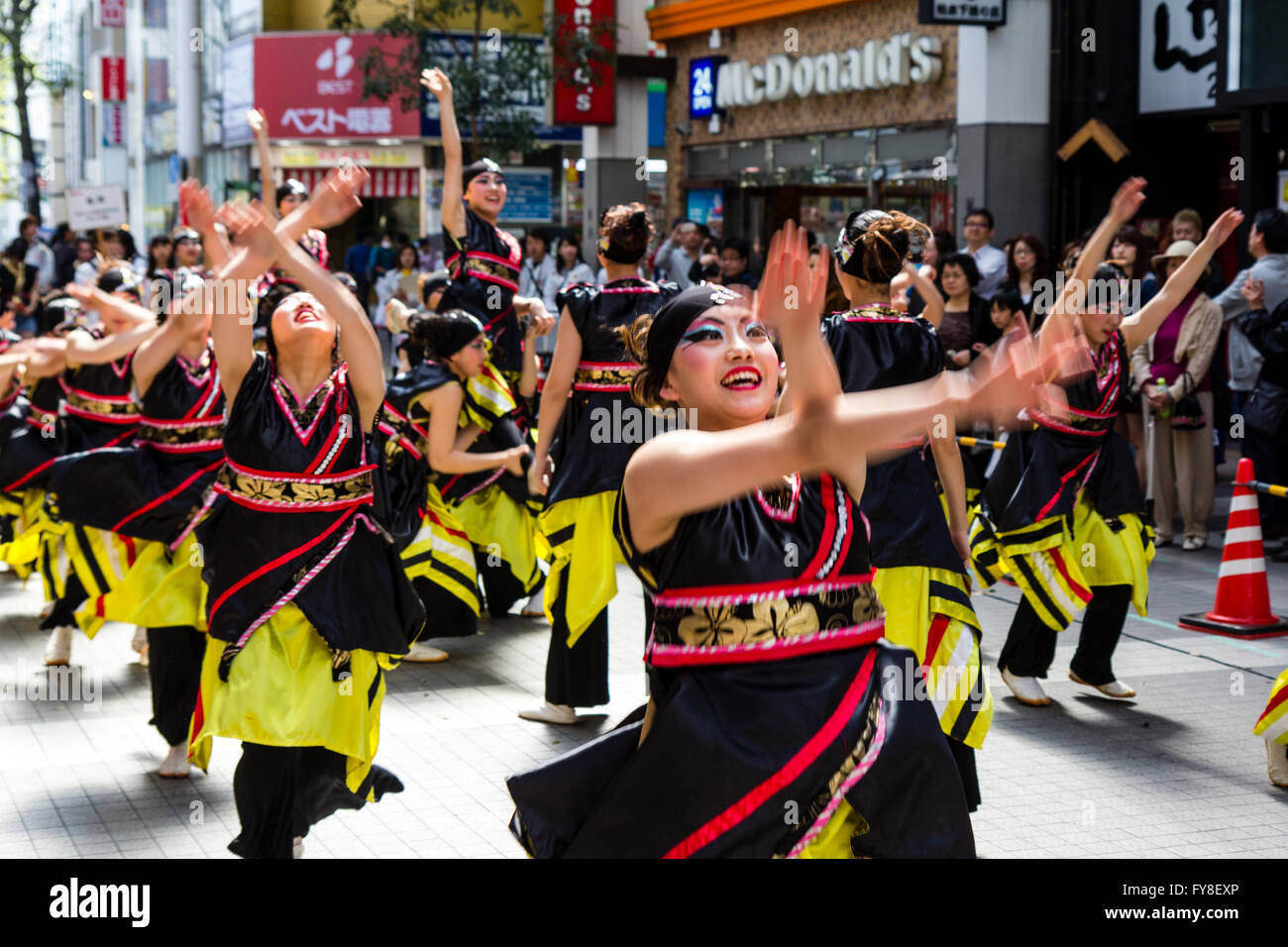 Japanese young women dance team in black and yellow outfits formation ...