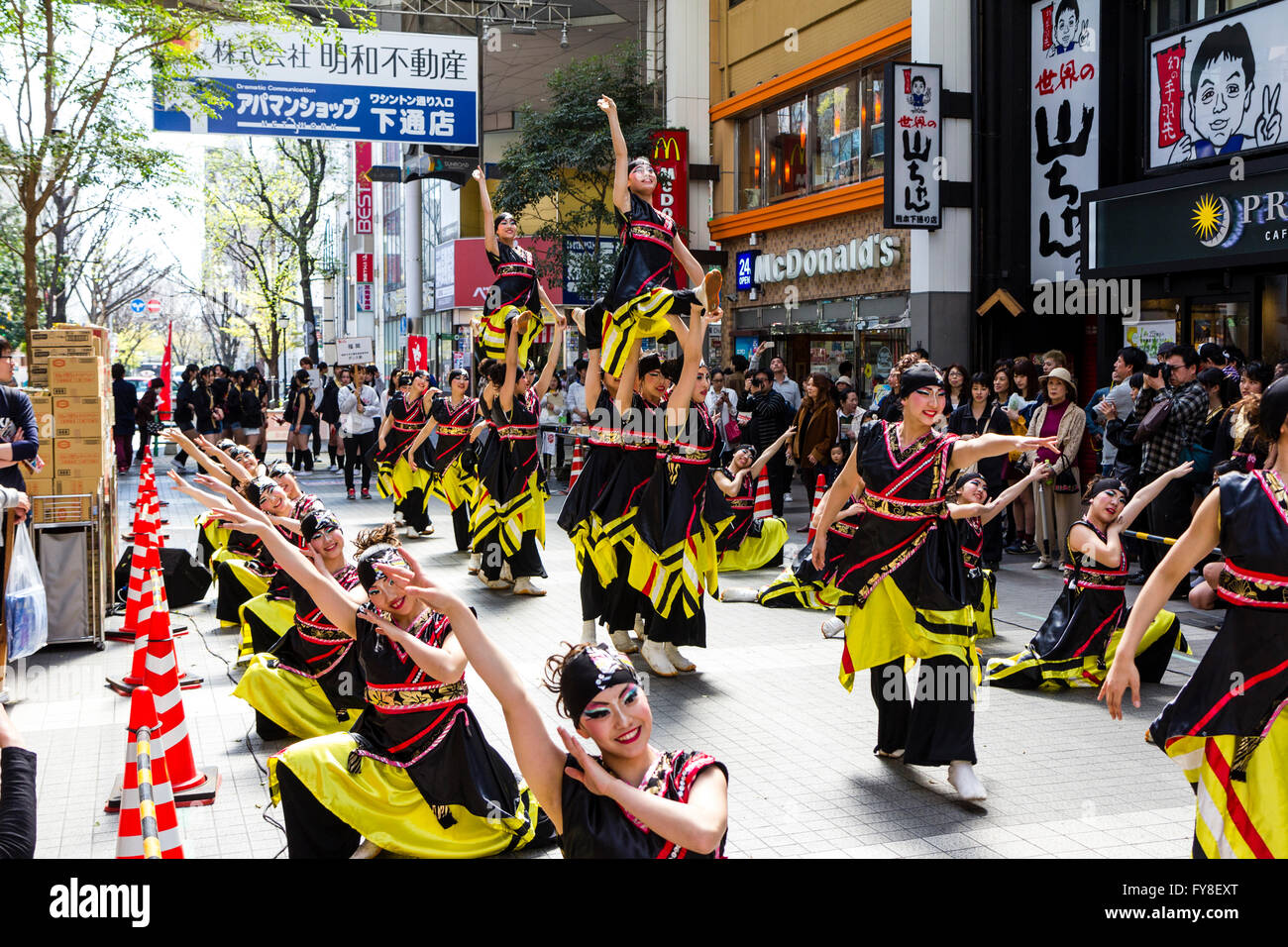 Japanese young women dance team in black and yellow outfits formation ...