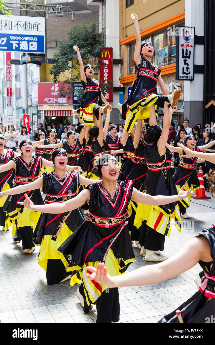 Japanese young women dance team in black and yellow outfits formation ...