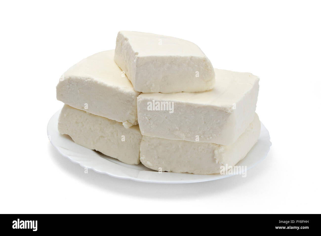 Fresh cheese from cow's milk on white background Stock Photo - Alamy