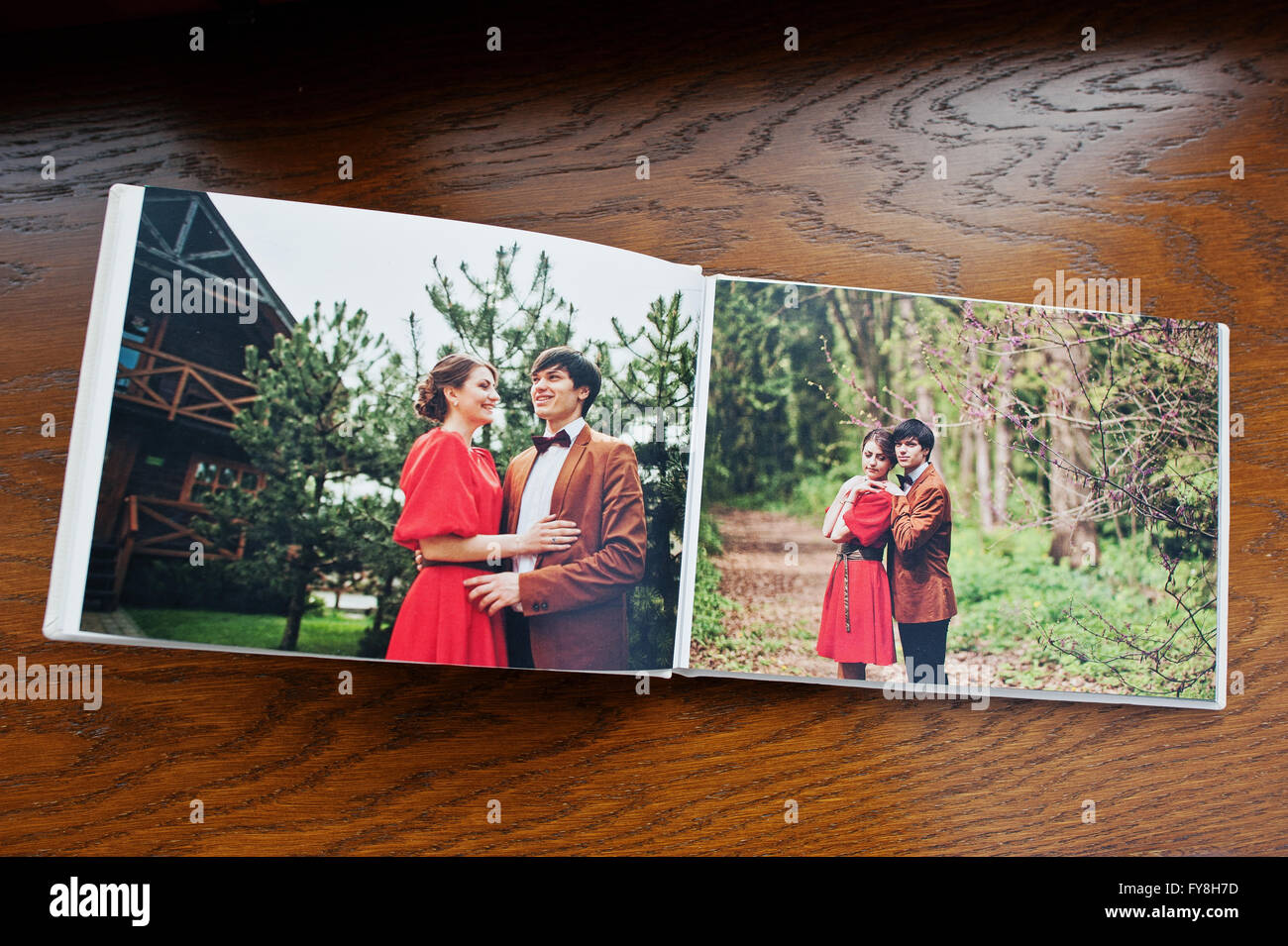 Open pages of album photobook couple in love on wooden background Stock ...