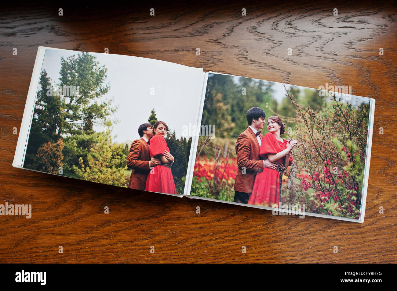 Open pages of album photobook couple in love on wooden background Stock ...