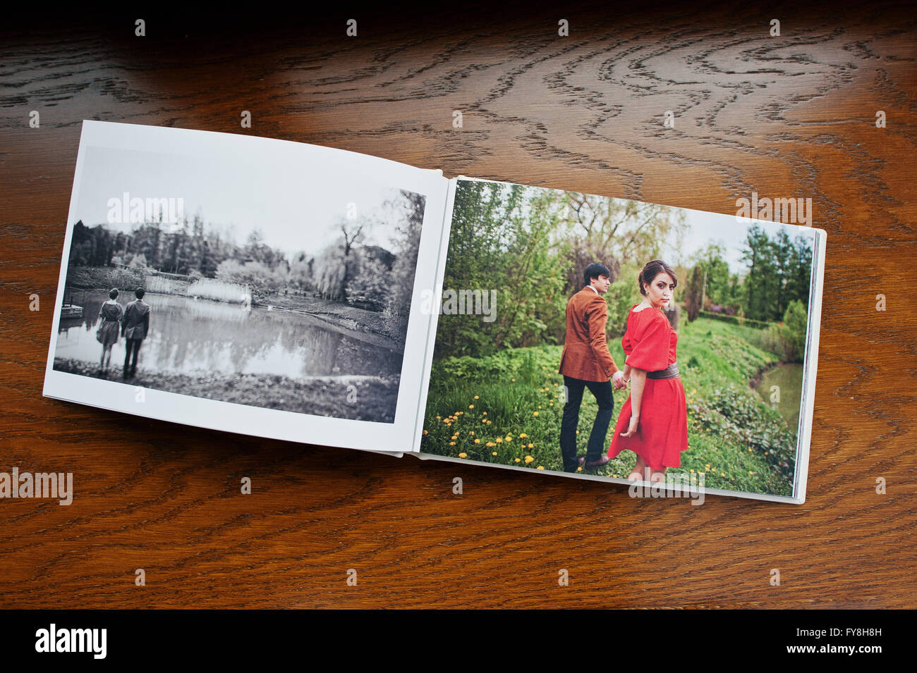 Open pages of album photobook couple in love on wooden background Stock ...