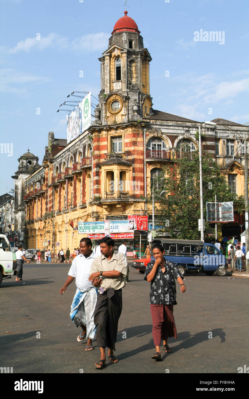 Yangon, Myanmar - 8 January 2010: People walking in front of a colonial ...