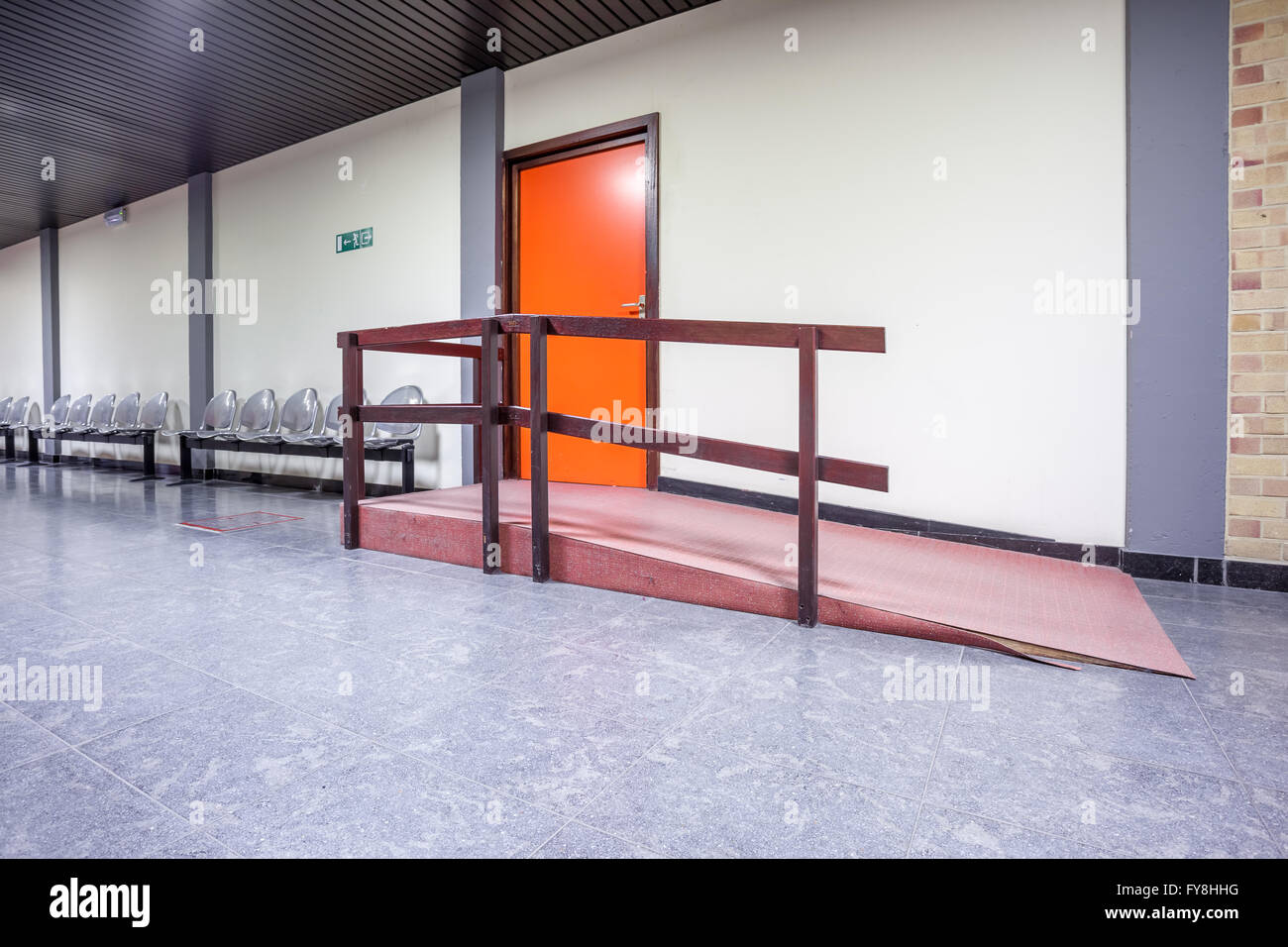 waiting room with a door with an ramp for wheelchair Stock Photo - Alamy