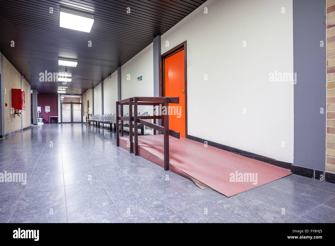 waiting room with a door with an ramp for wheelchair Stock Photo - Alamy
