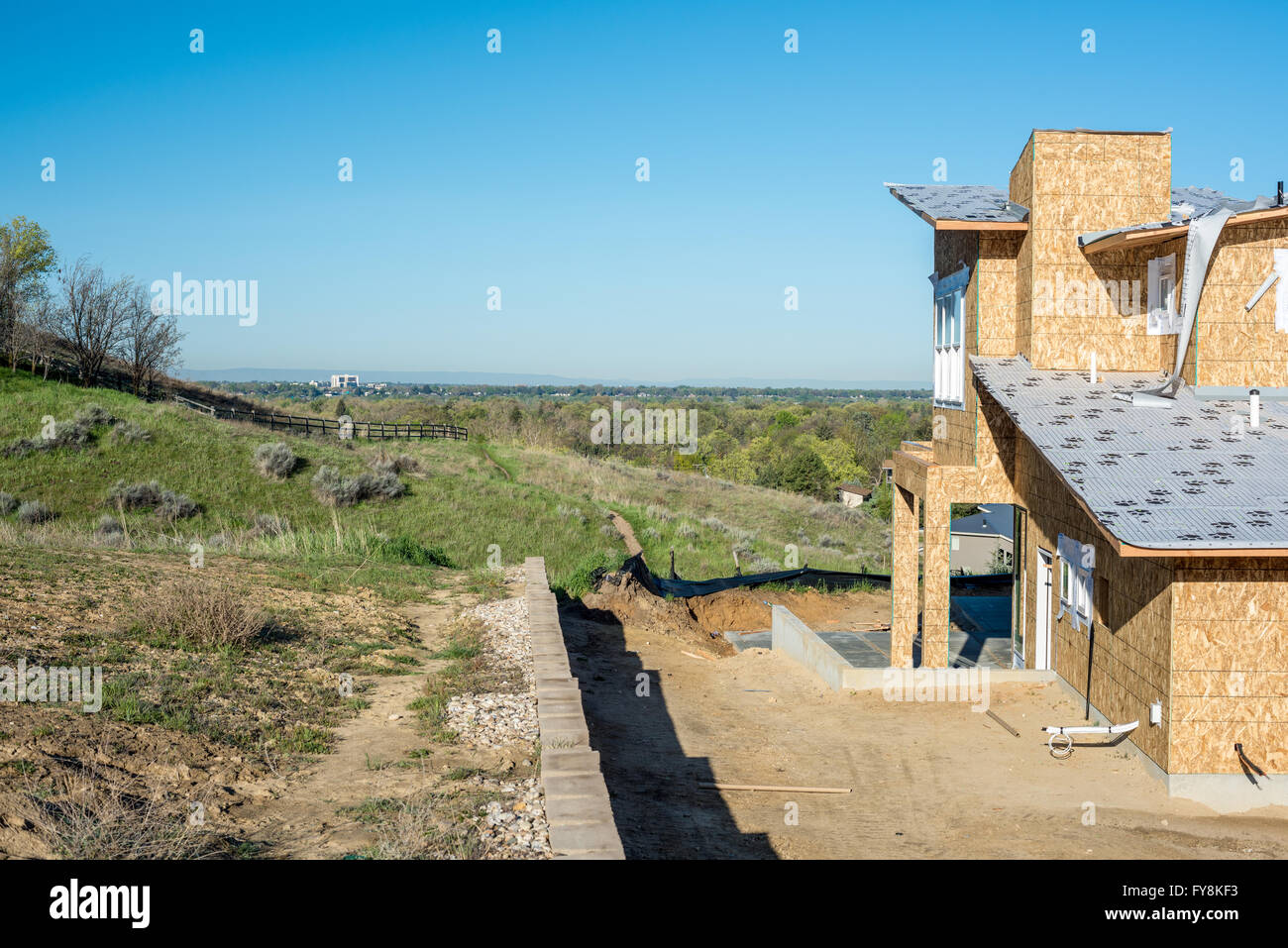 New home construction on a hill over the city Stock Photo - Alamy